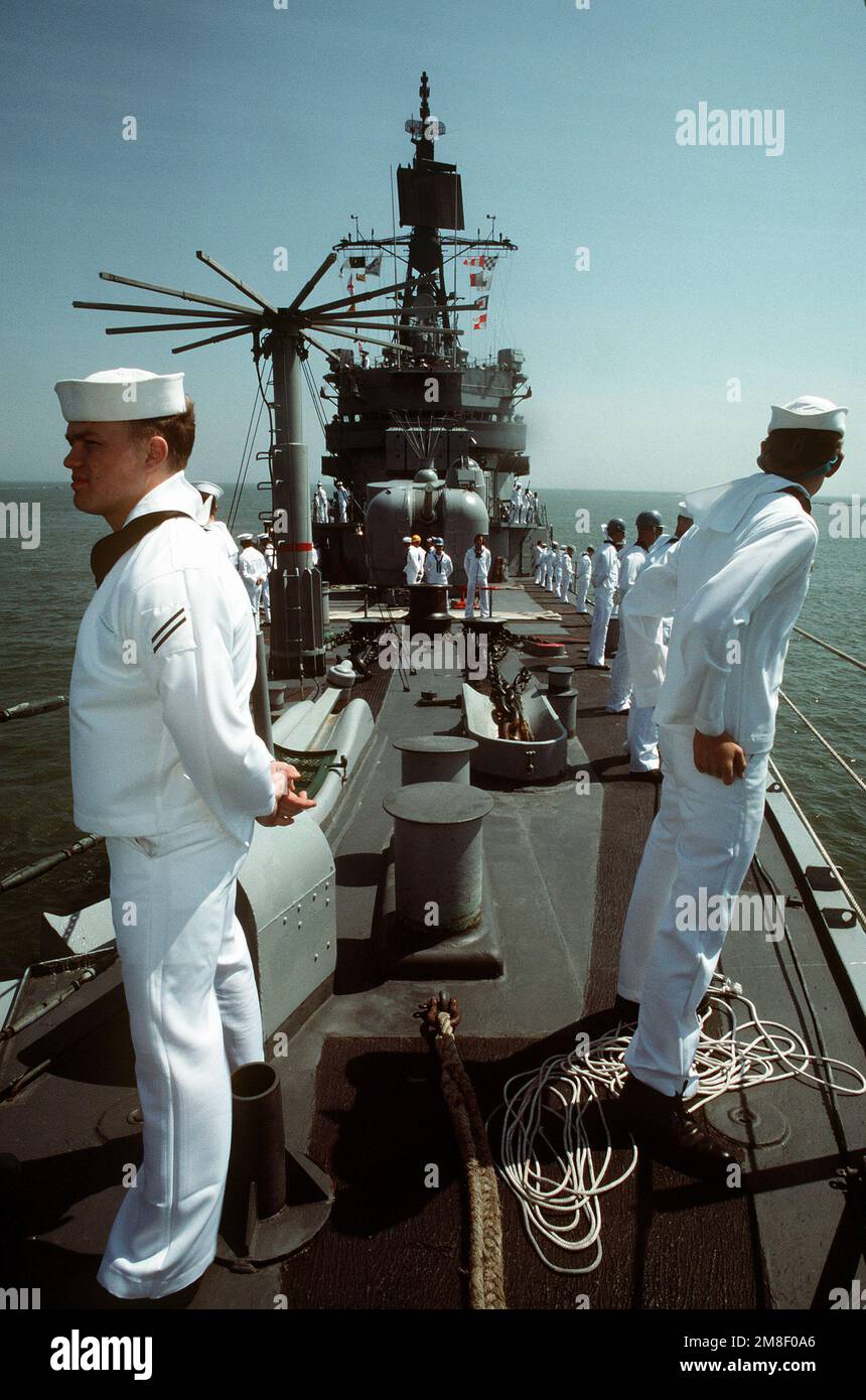 Sailors aboard the guided missile destroyer USS MACDONOUGH (DDG-39) man ...