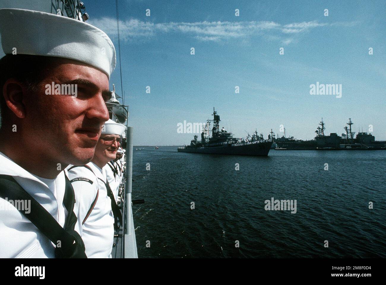 Sailors manning the rails aboard the guided missile frigate USS ...