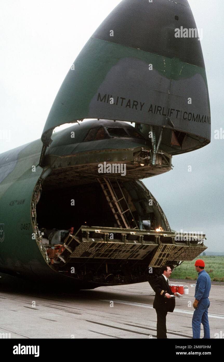 A crewman lowers the nose ramp of an 436th Military Airlift Wing C-5 ...
