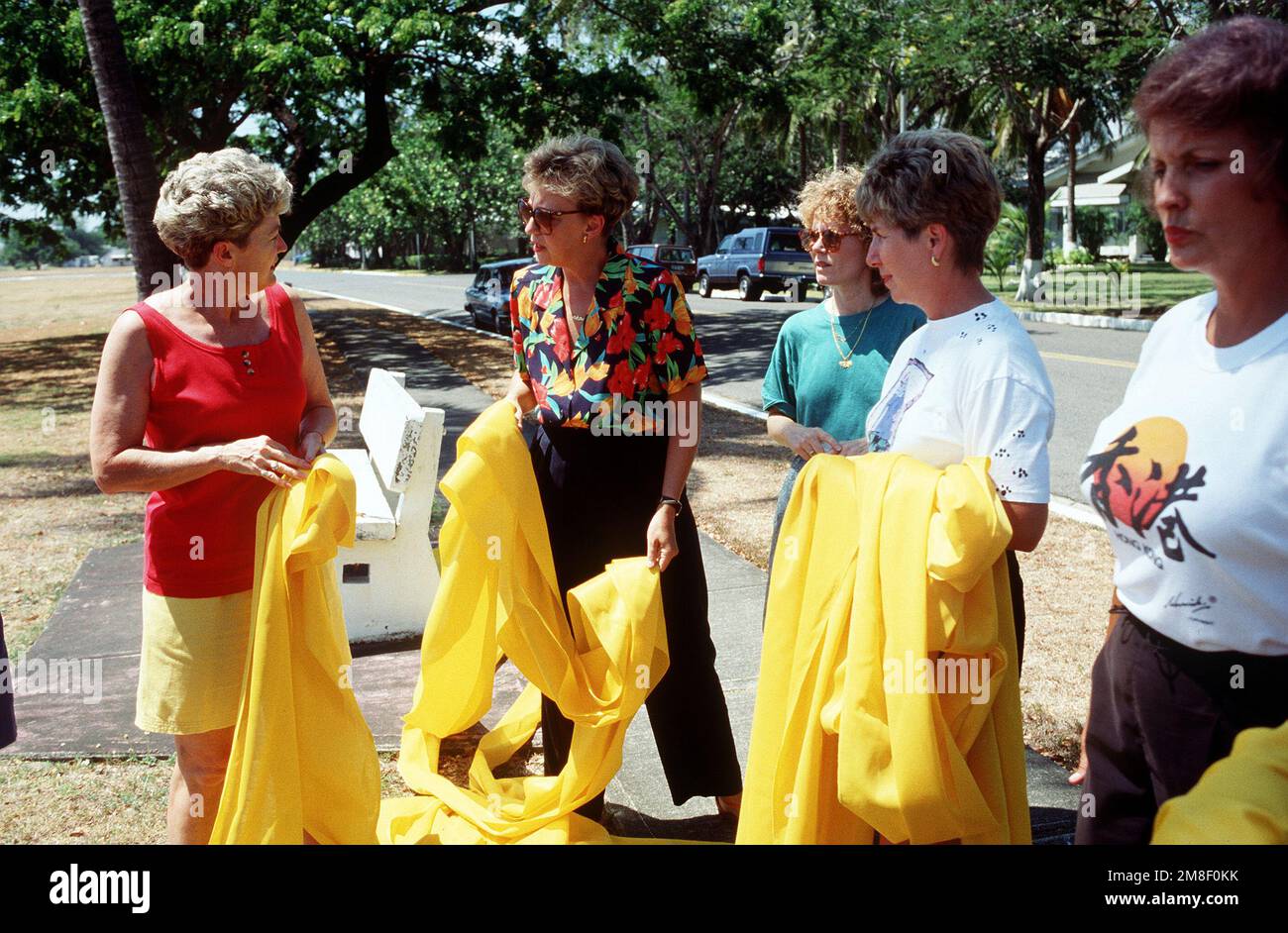 Members of a base women's organization discuss where they will hang ...