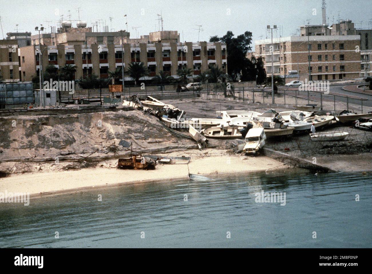 Small boats litter the beach of Kuwait City in the aftermath of the ...
