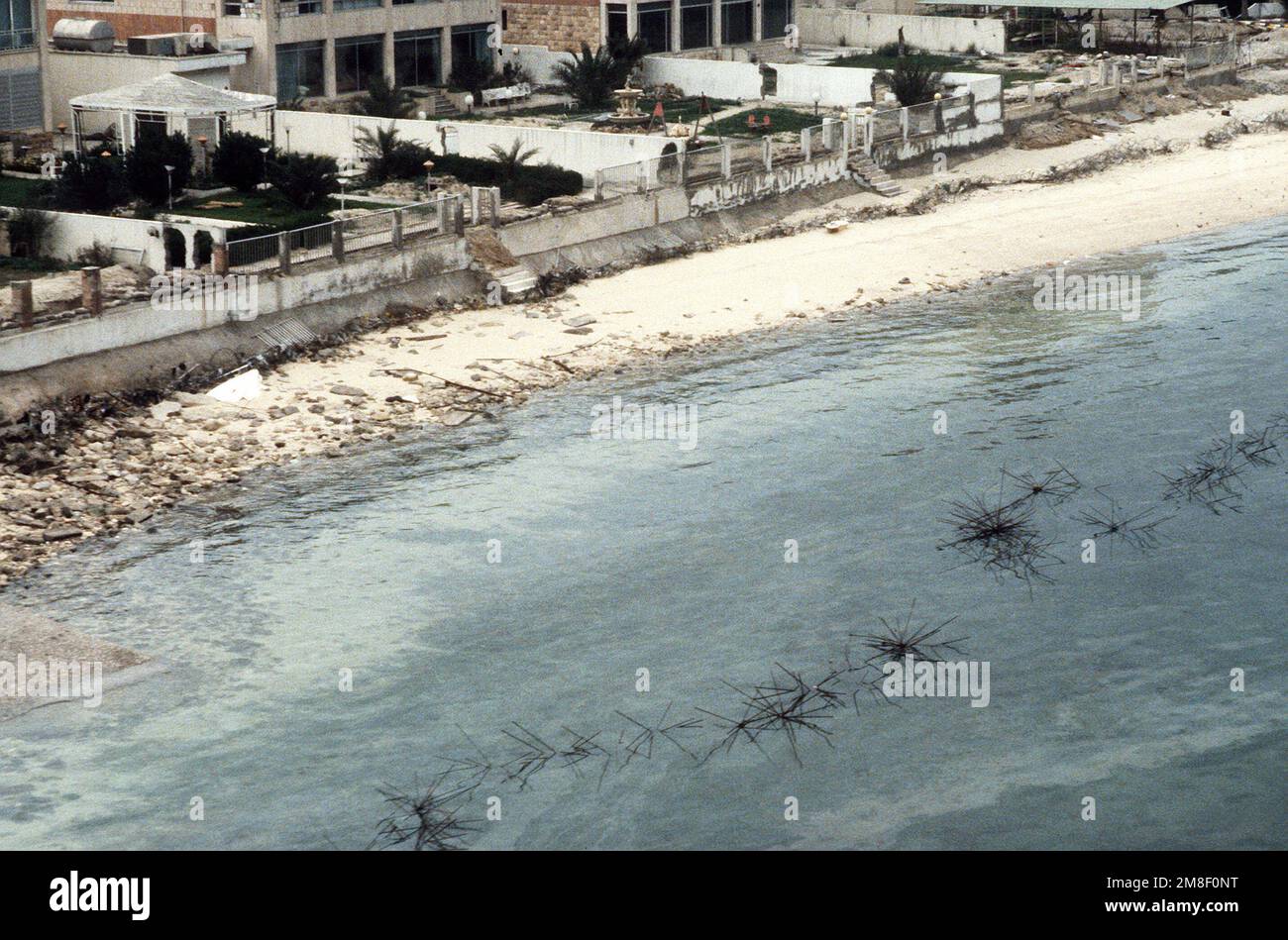A metal barricade protrudes from the water in the aftermath of ...