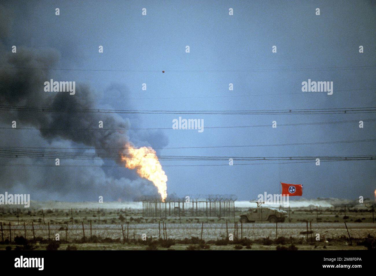 An oil fire blazes out of control outside of Kuwait City. Many wells ...