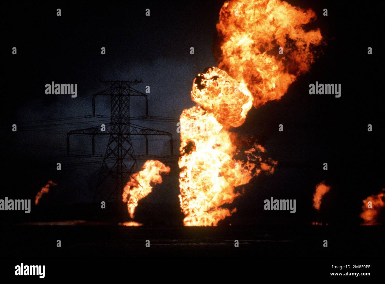 Oil well fires rage out of control after being set by occupying Iraqi ...