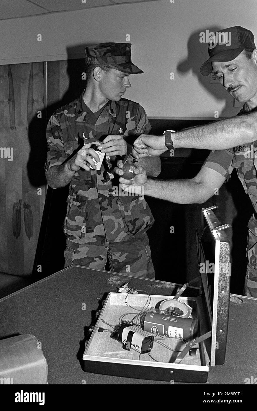 Explosive ordnance disposal team members take part in a bomb drill ...