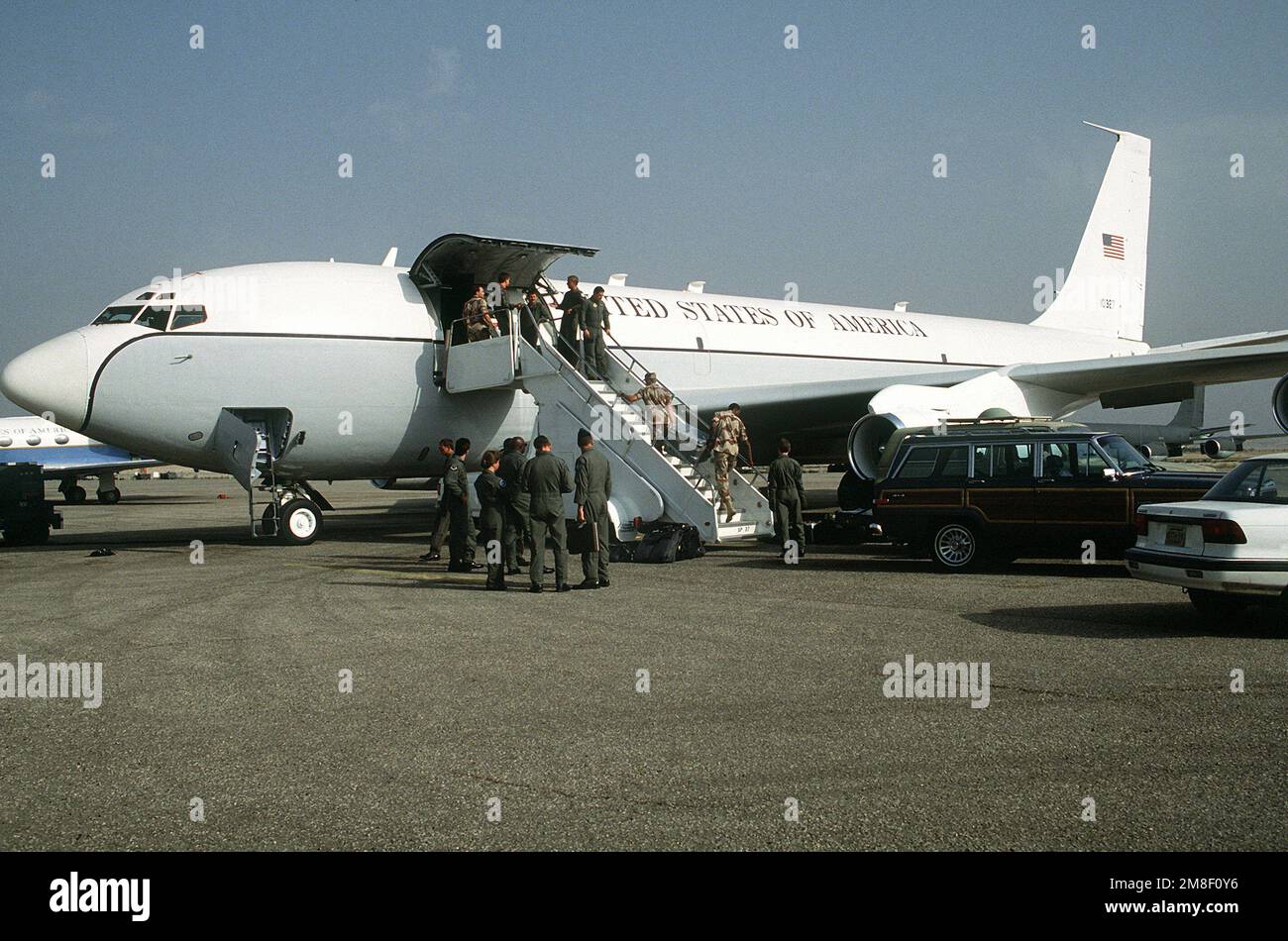 Luggage is loaded aboard a VC-135 Stratolifter aircraft as GEN. Norman ...