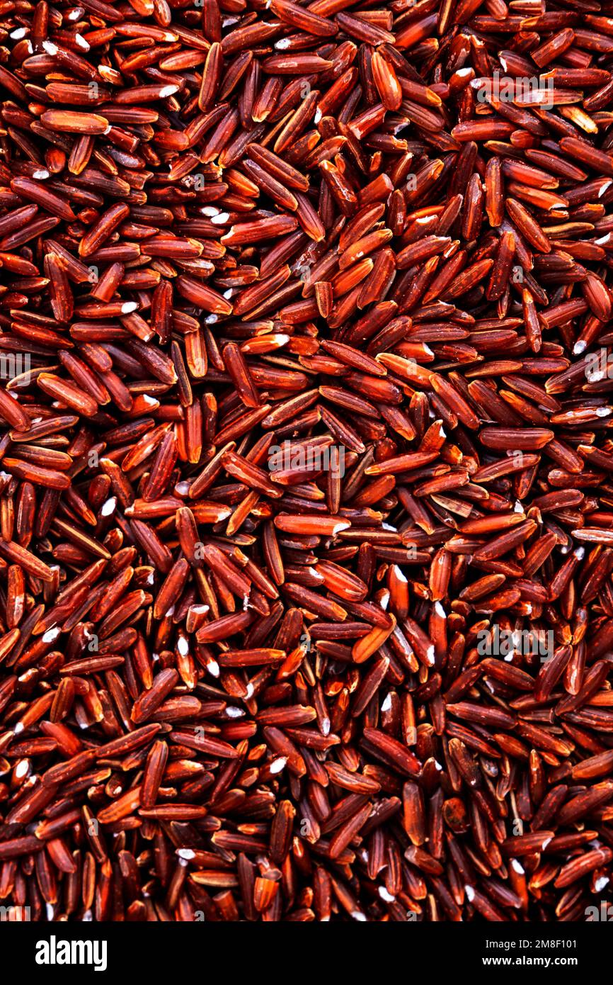 Wild raw red rice groats, food background texture, top view Stock Photo ...