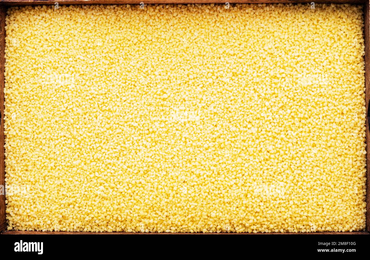 Couscous, dry wheat grain, food background texture, top view Stock ...