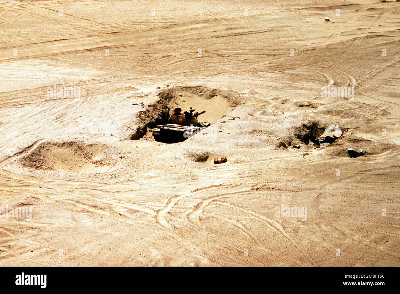 A burned out Iraqi T-55 main battle tank destroyed in southern Iraq ...