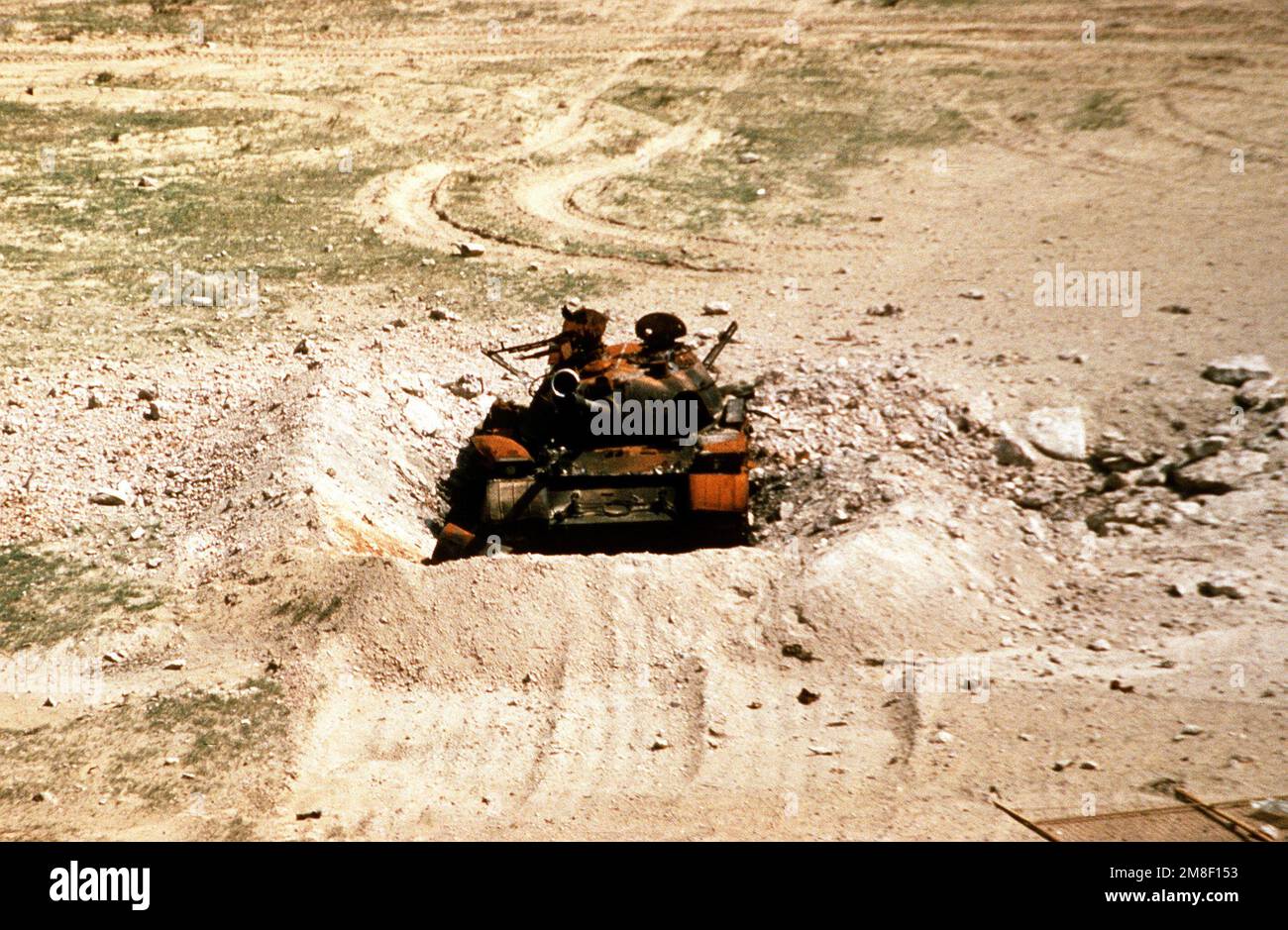 A burned out Iraqi T-55 main battle tank destroyed in southern Iraq ...