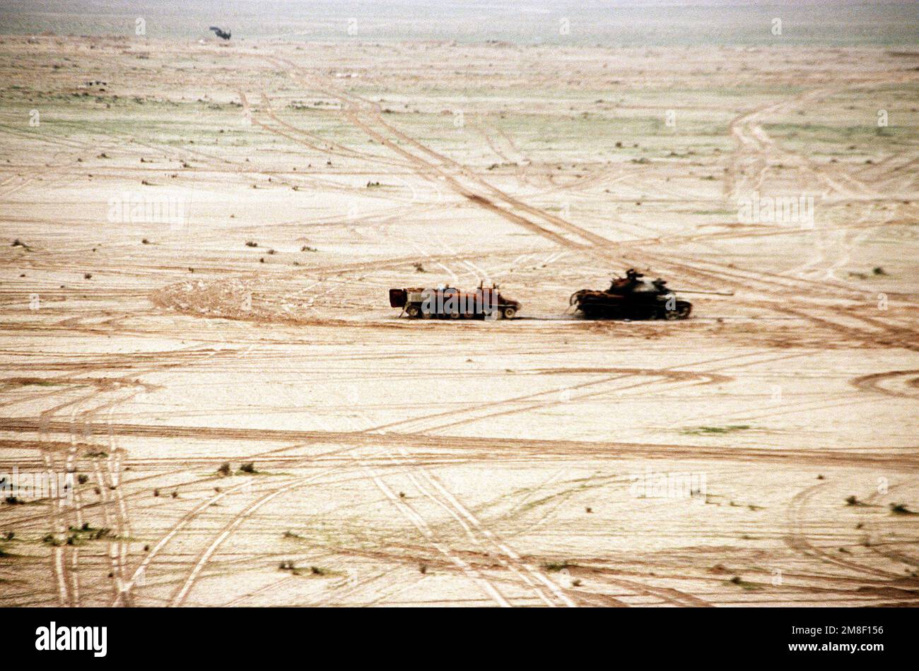 An Iraqi T-55 main battle tank and an MT-LB armored personnel carrier ...