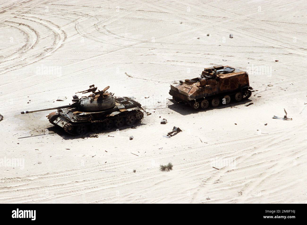 An Iraqi T-55 main battle tank and YW-701 armored personnel carrier ...