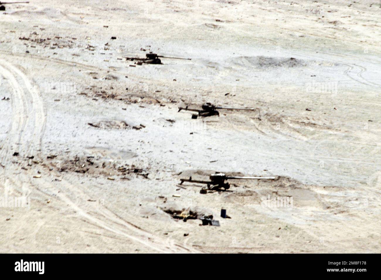 An Iraqi artillery battery abandoned during Operation Desert Storm ...