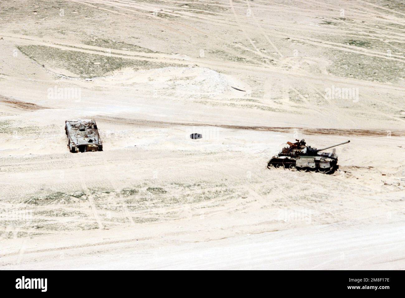 An Iraqi T-55 main battle tank and a BMP-1 armored personnel carrier ...