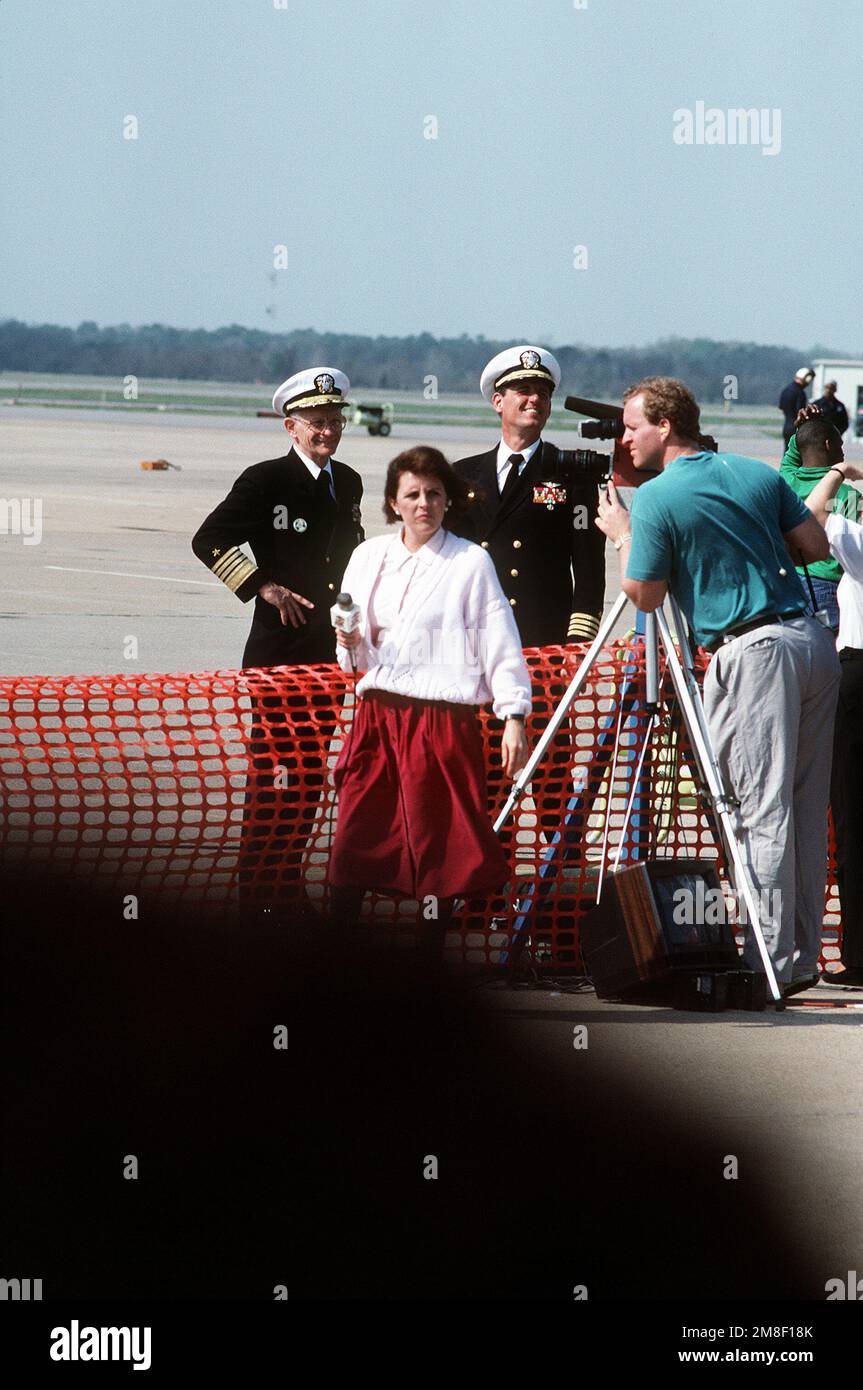 A reporter from a local television station prepares to interview Adm ...