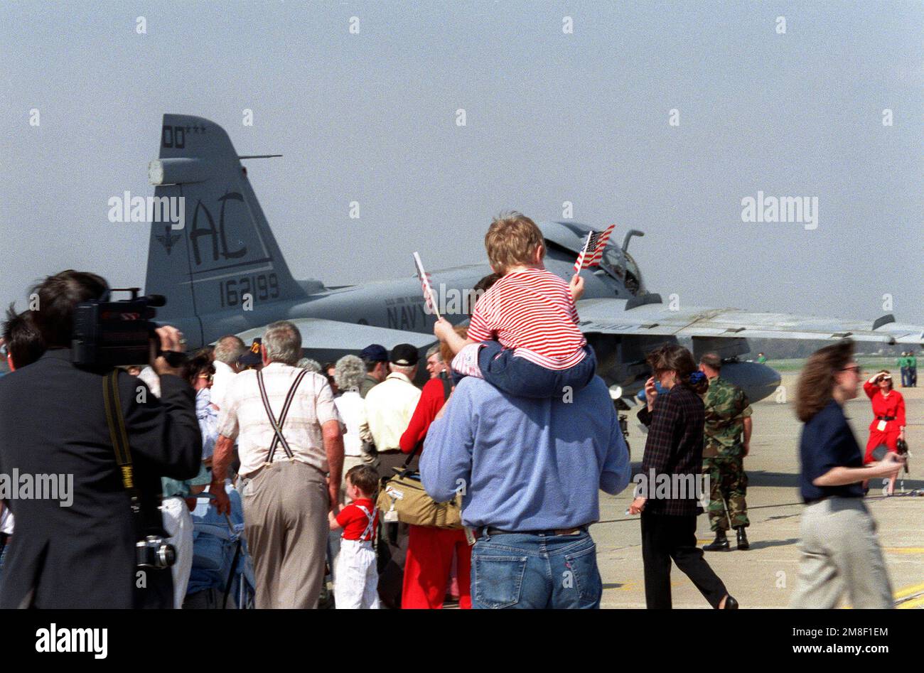 A crowd gathers near an Attack Squadron 75 (VA-75) A-6E Intruder ...