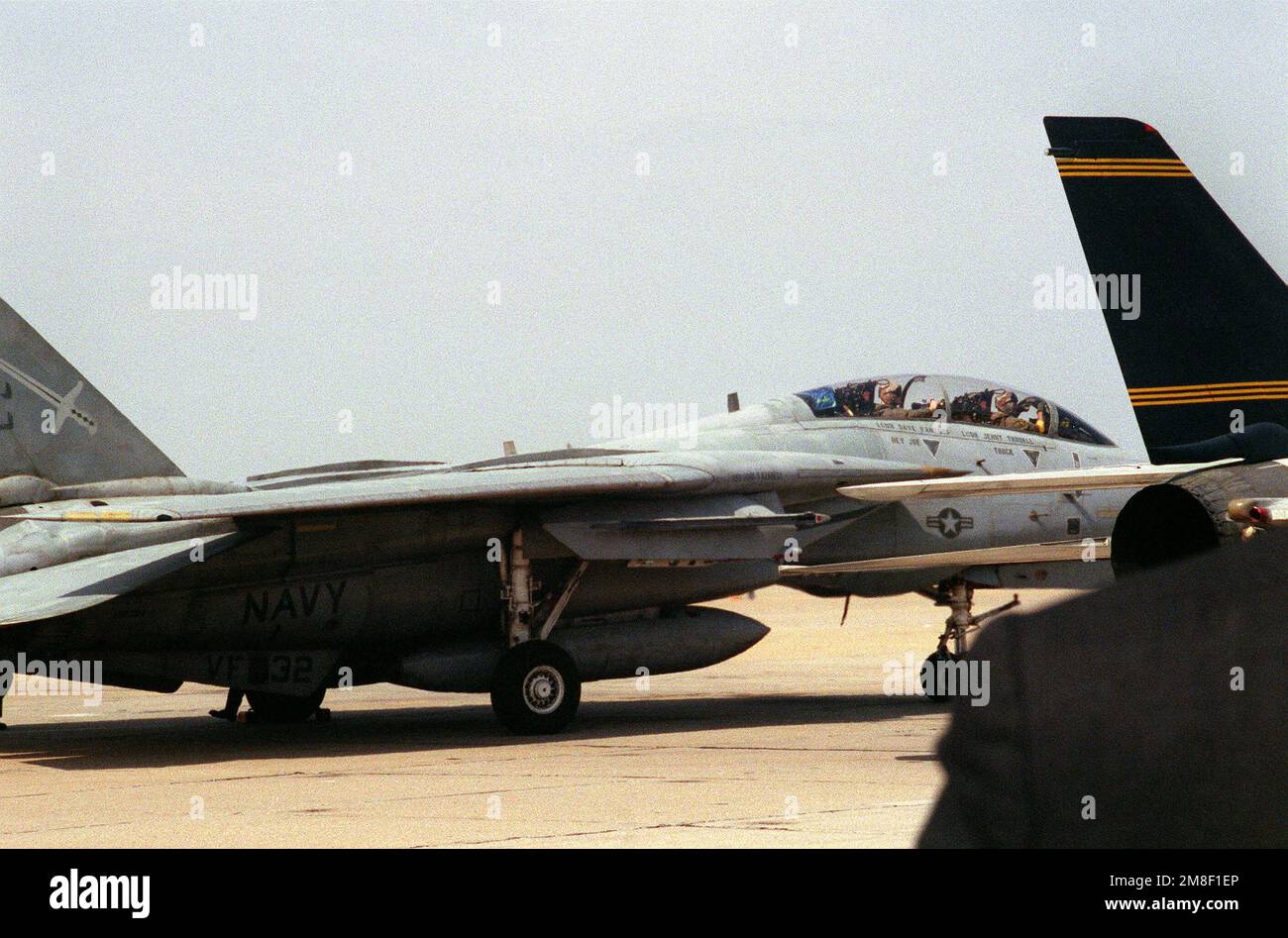 A Fighter Squadron 32 (VF-32) F-14A Tomcat aircraft arrives on base ...