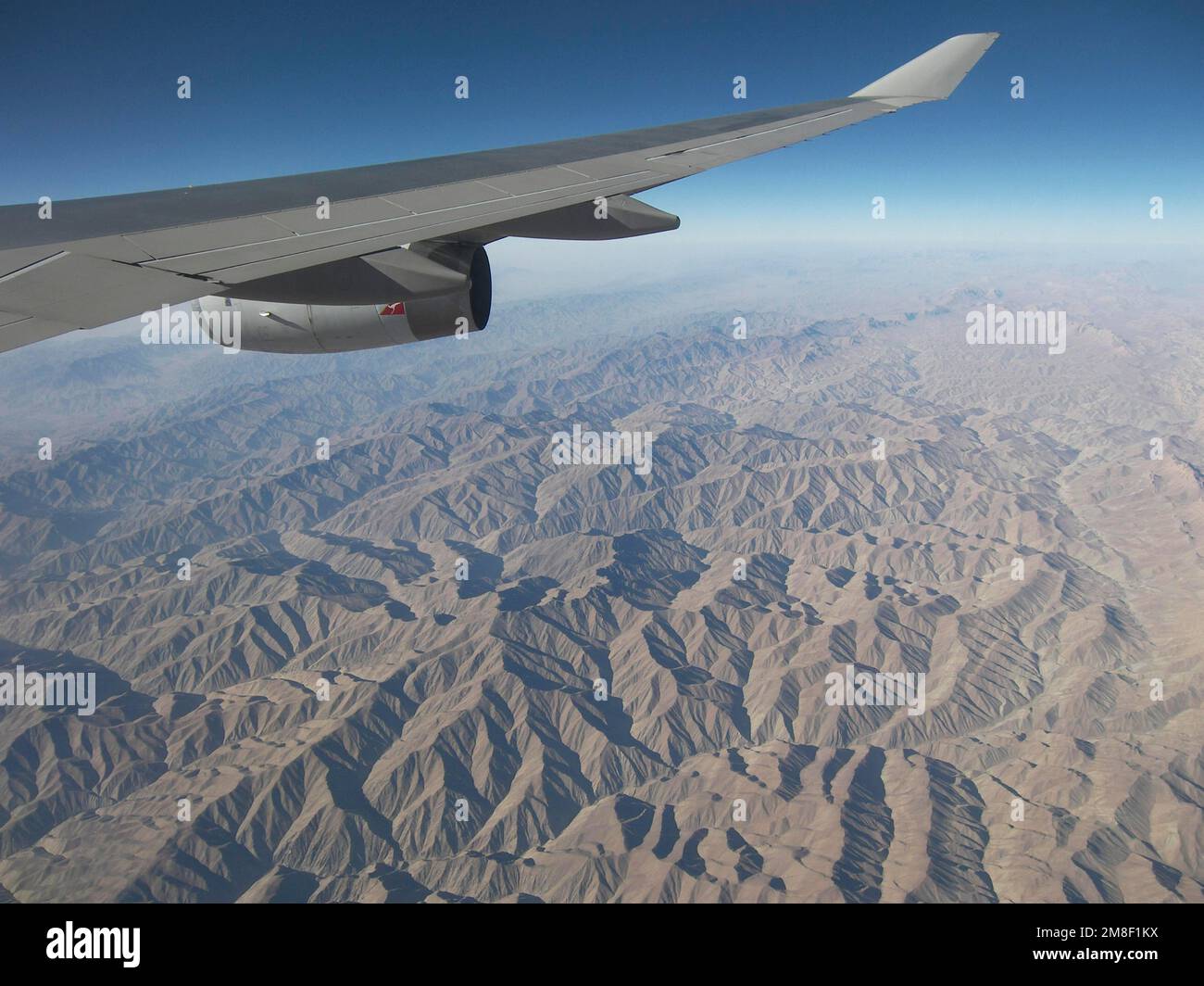 View from the plane of the inhospitable mountainous country in the ...