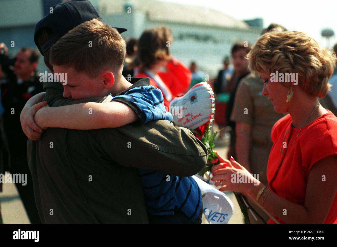 LT. Tony DeRossett of Attack Squadron 75 (VA-75) is reunited with his ...