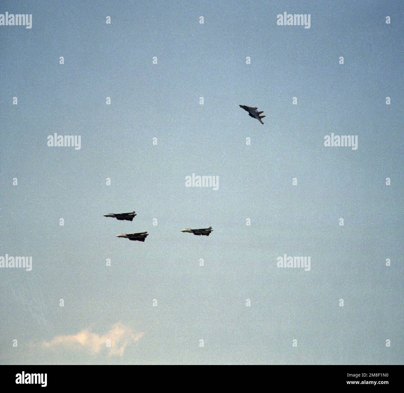 A Carrier Air Wing 3 (CVW-3) F-14A Tomcat aircraft leaves its formation ...