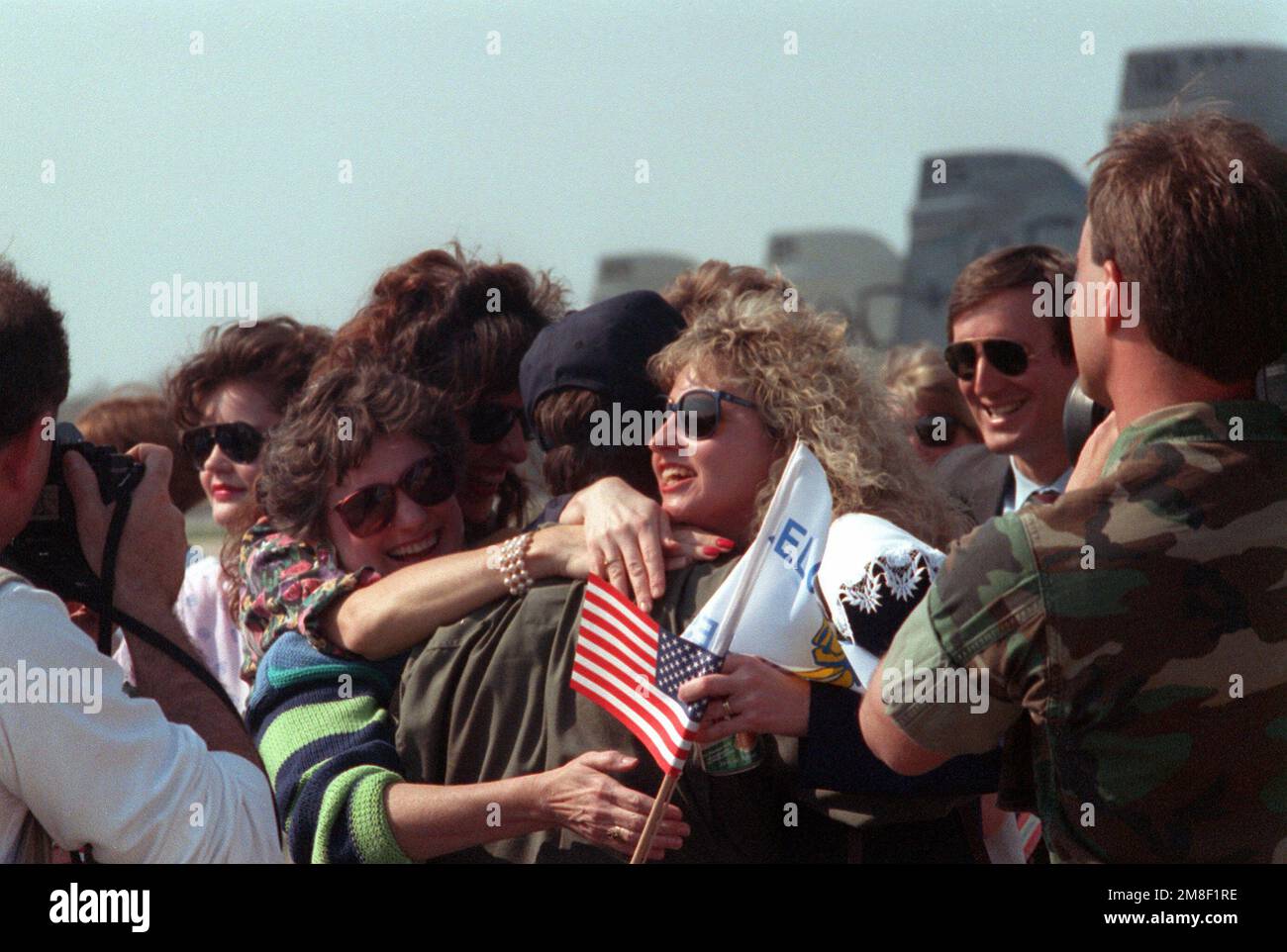 A naval aviator from Attack Squadron 75 (VA-75) is welcomed home by ...