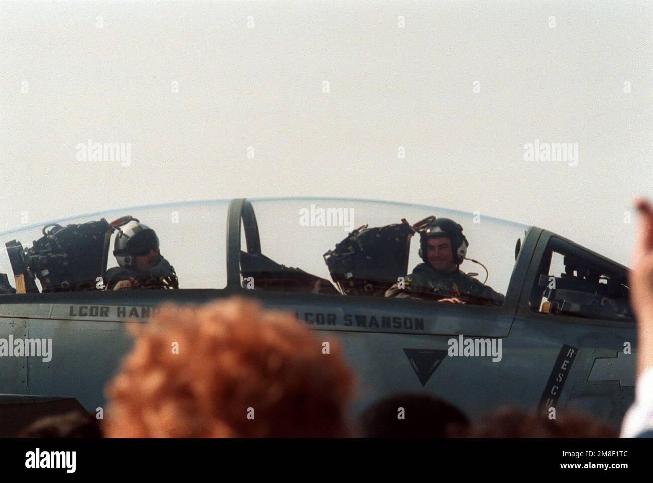 The pilot and radar intercept officer of a Fighter Squadron 103 (VF-103) F-14A Tomcat aircraft ...