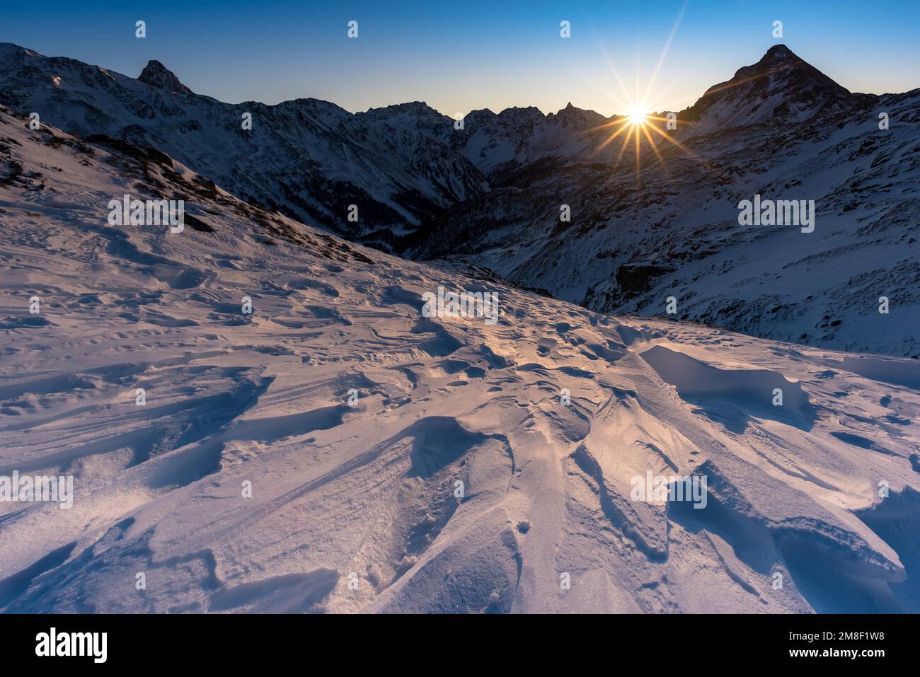 Winter landscape in the Grisons mountains at sunrise, Canton Grisons ...