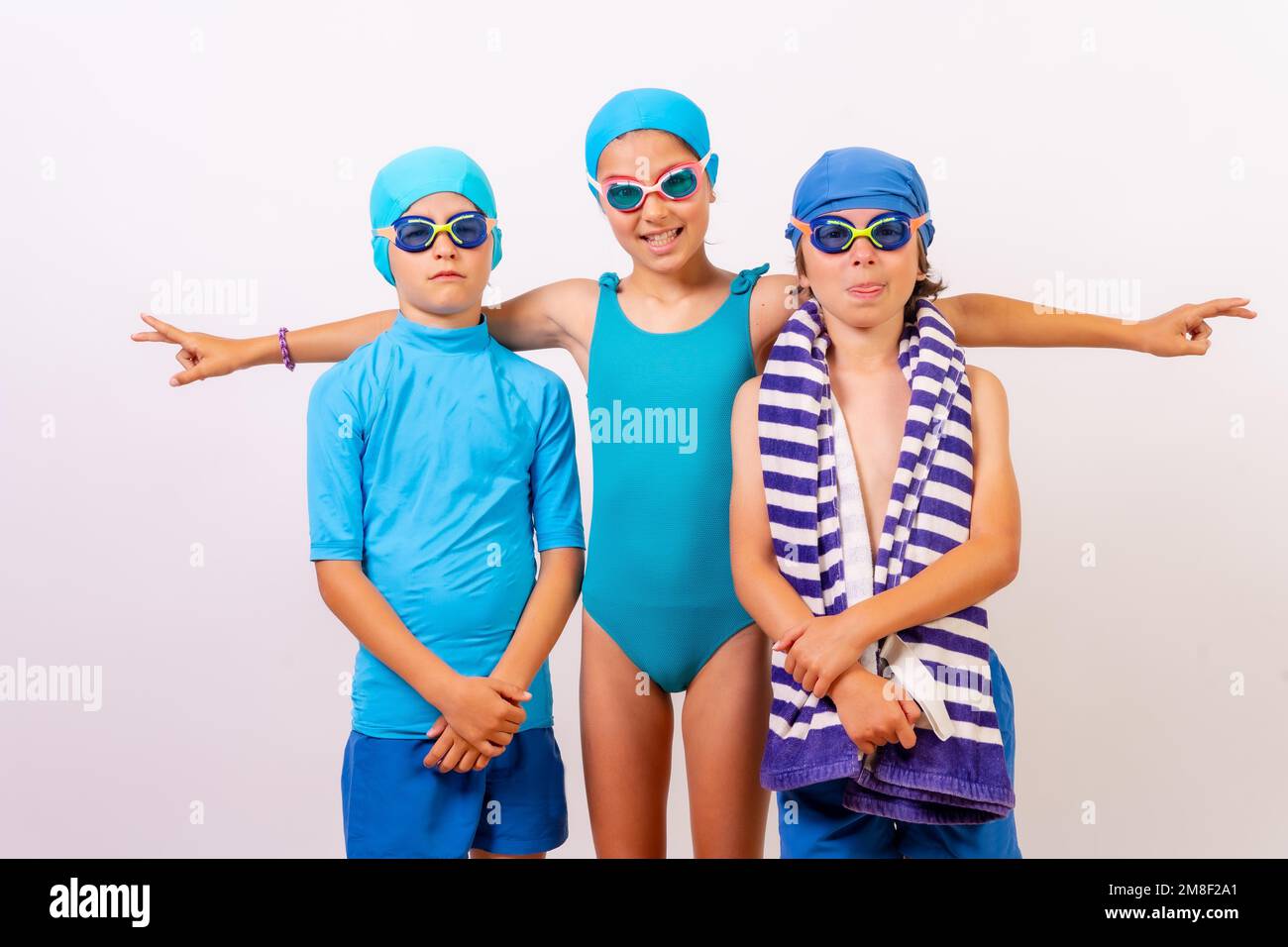 Portrait of brothers dressed in swimsuits for swimming lessons in the ...