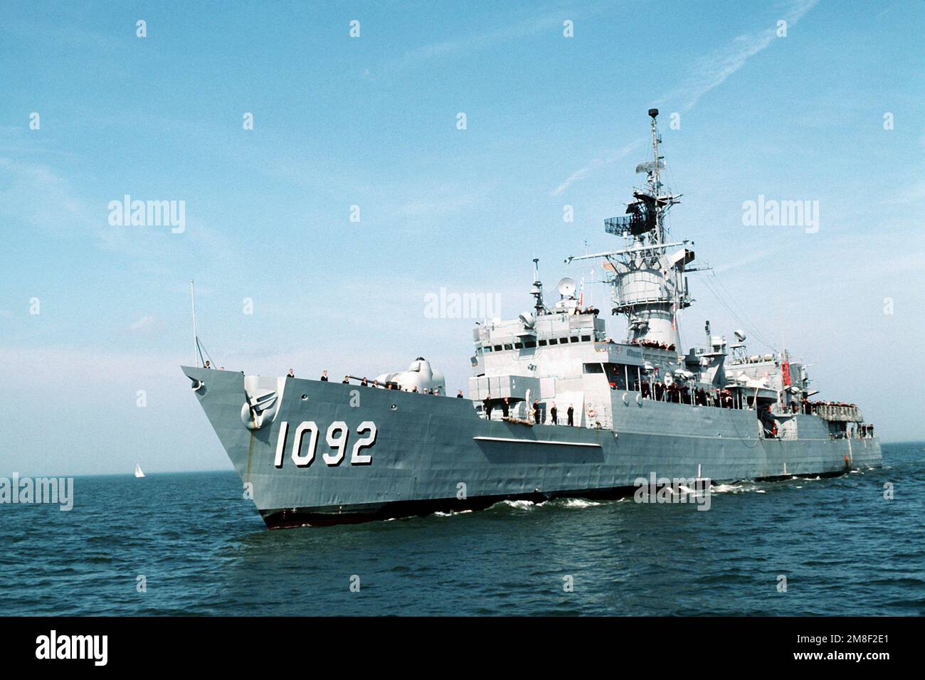 A port bow view of the frigate USS THOMAS C. HART (FF-1092) with ...