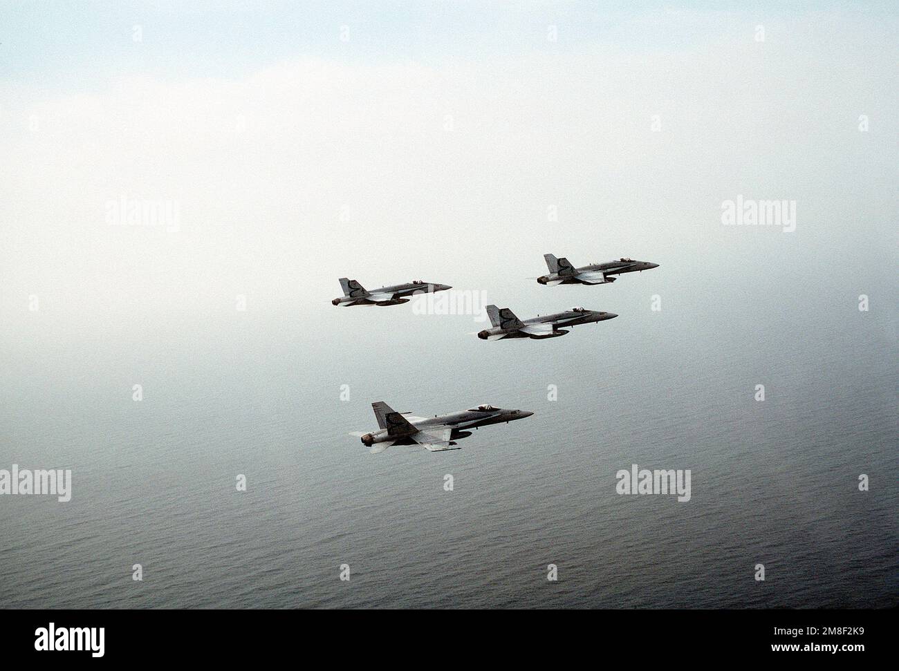 F/A-18 Hornet aircraft fly in formation as they take part in a flyover ...