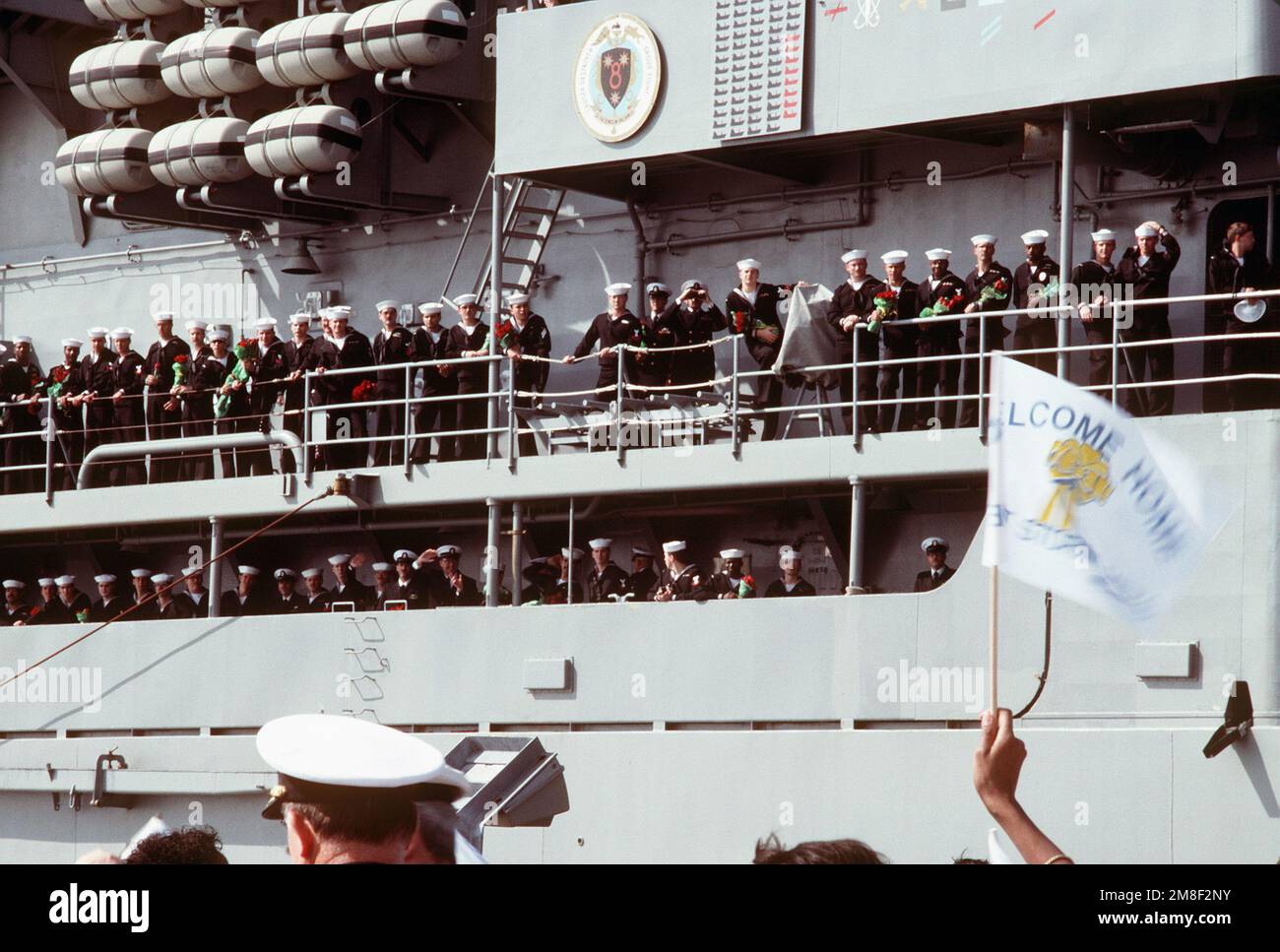Crew members aboard the nuclear-powered guided missile cruiser USS ...