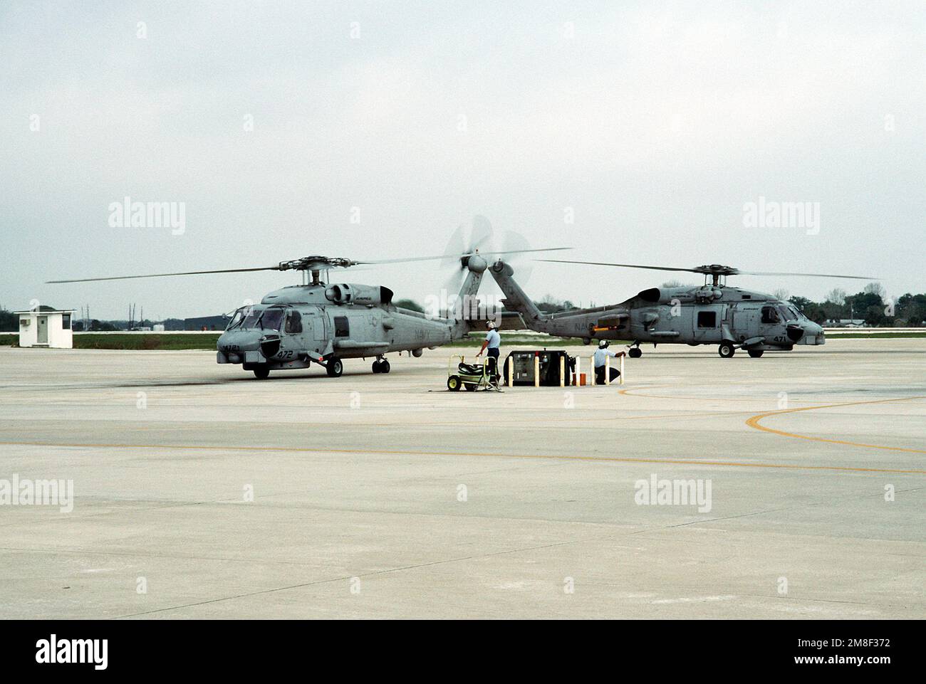 Two SH-60B Sea Hawk helicopters from Light Helicopter Anti-submarine ...