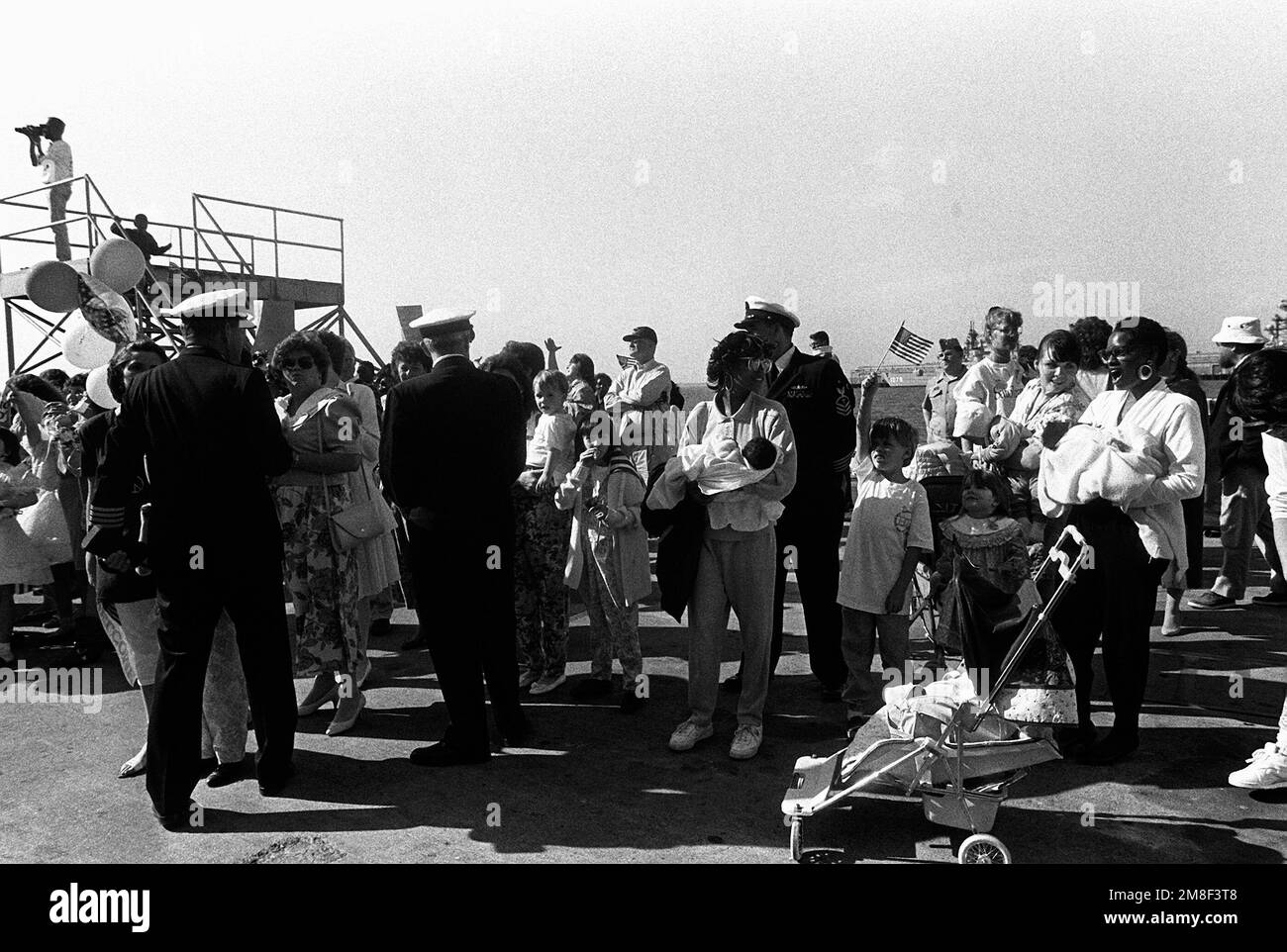 Friends and family members of crewmen aboard the guided missile cruiser ...