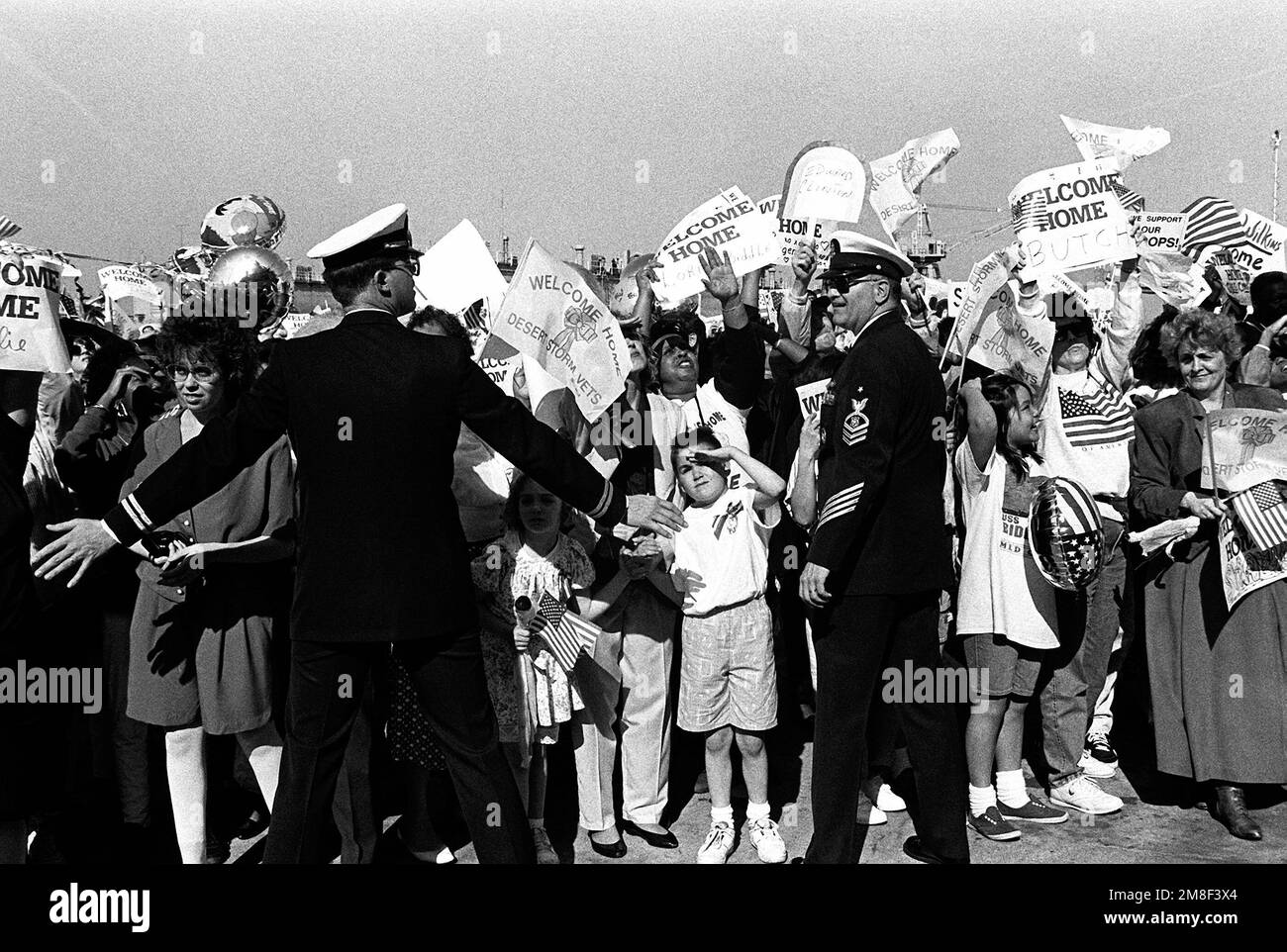 A lieutenant and a chief petty officer help control the enthusiastic ...