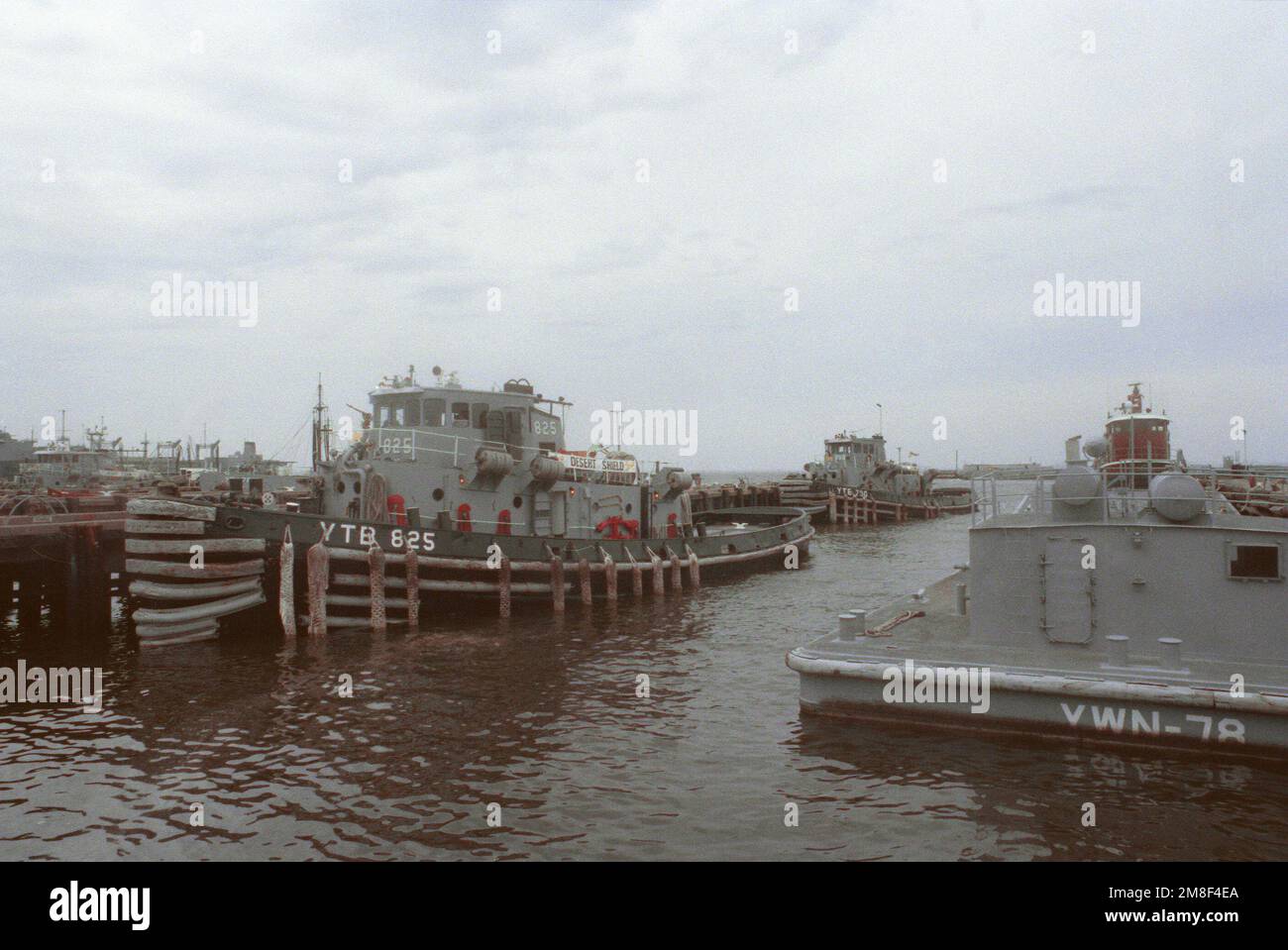 A port bow view of the bow of the large harbor tug WATHENA (YTB-825 ...