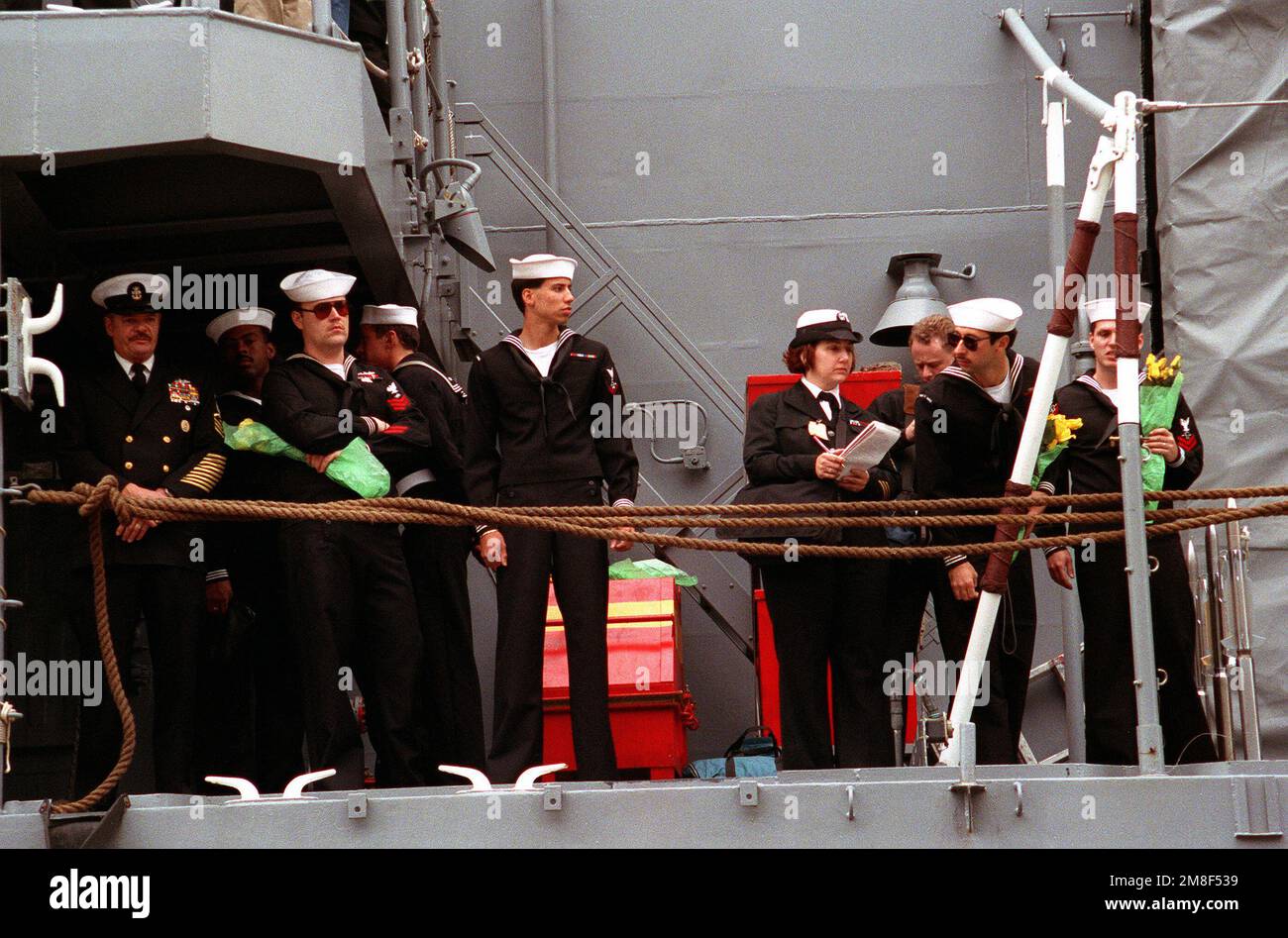 Crew members aboard the guided missile cruiser USS THOMAS S. GATES (CG ...
