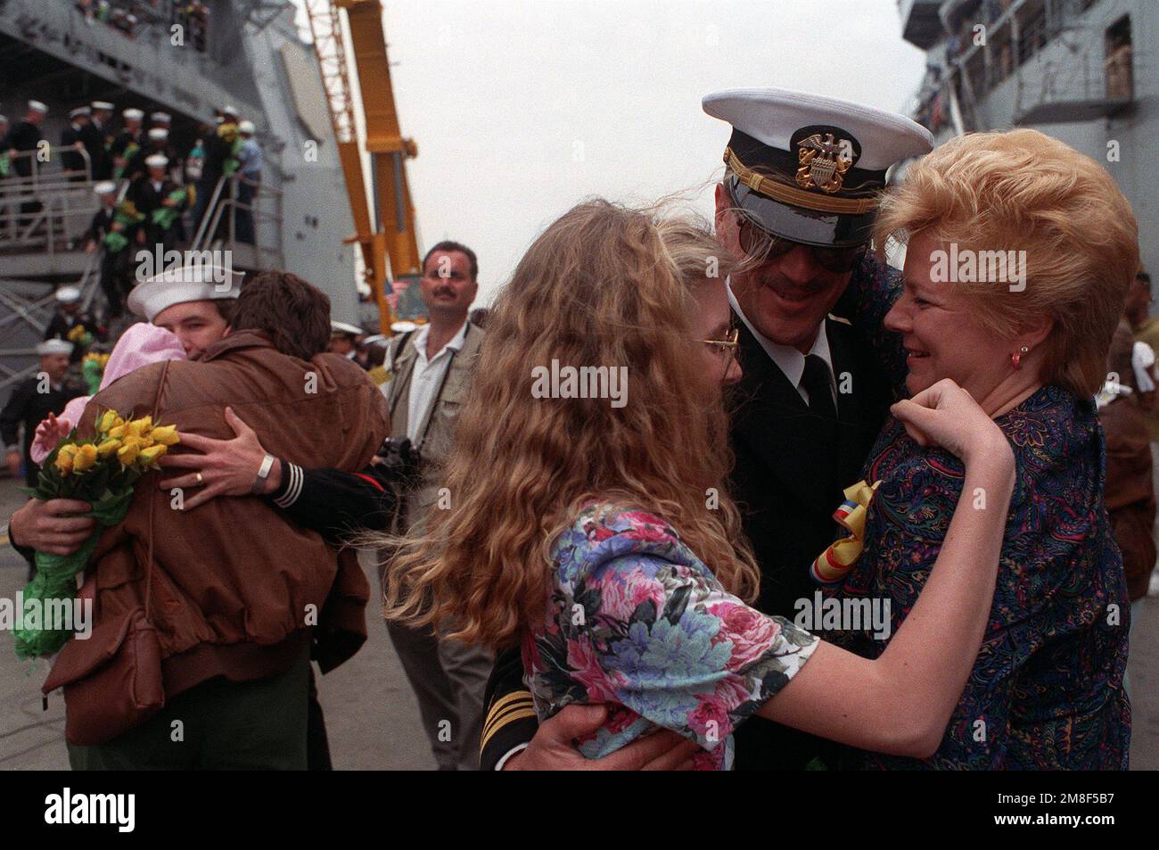 An officer assigned to the guided missile cruiser USS THOMAS S. GATES ...