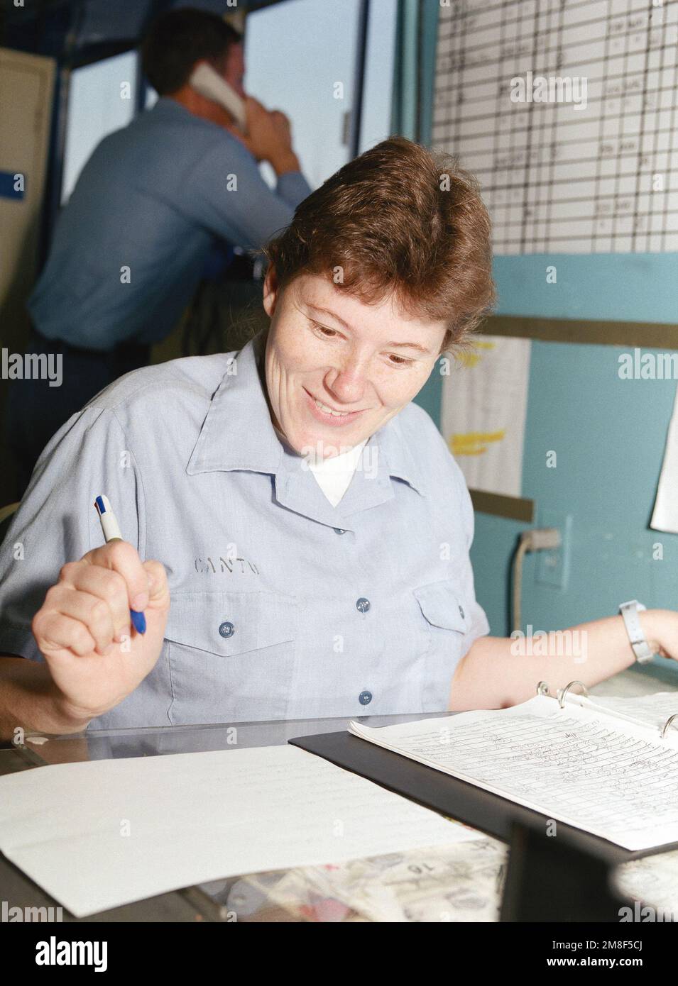 Aviation Machinist's Mate 3rd Class Janel Cantu updates a tool log ...