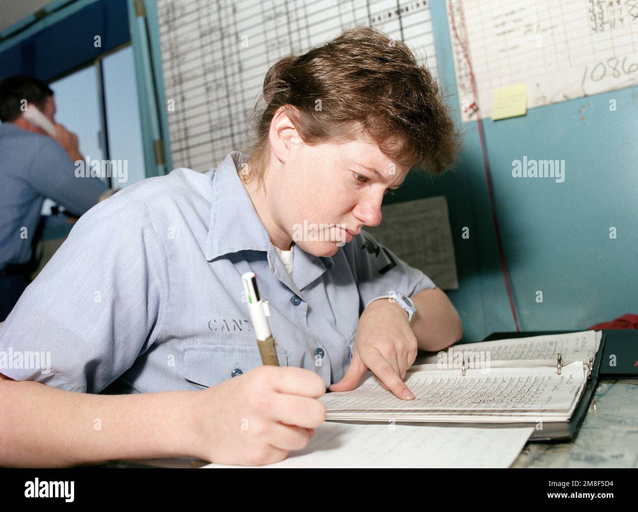 Aviation Machinist's Mate 3rd Class Janel Cantu updates a tool log in ...