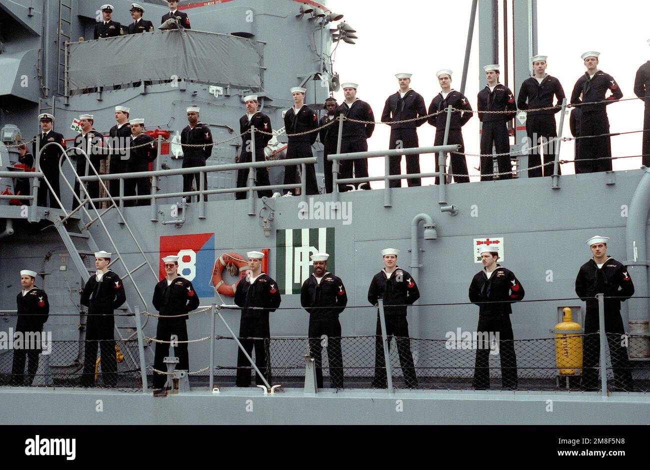 Crew members man the rails aboard the guided missile destroyer USS SAMPSON (DDG-10). The SAMPSON ...
