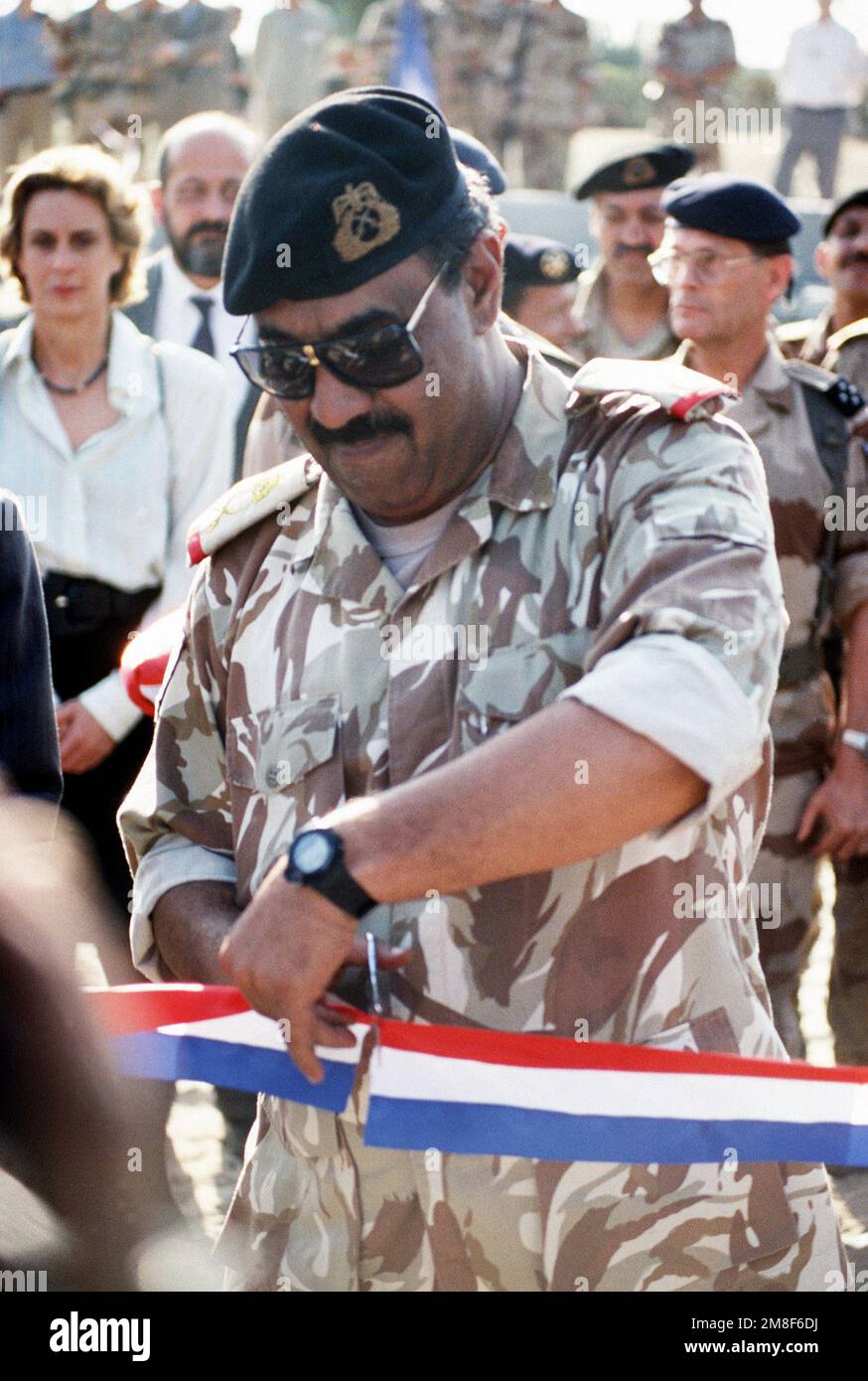 GEN. Jaber Khalid Al Sabon of Kuwait cuts the ribbon at the reopening ...