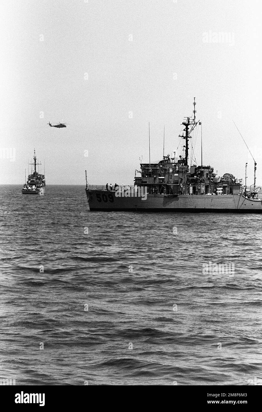 A port view of the ocean minesweeper USS ADROIT (MSO-509) conducting ...