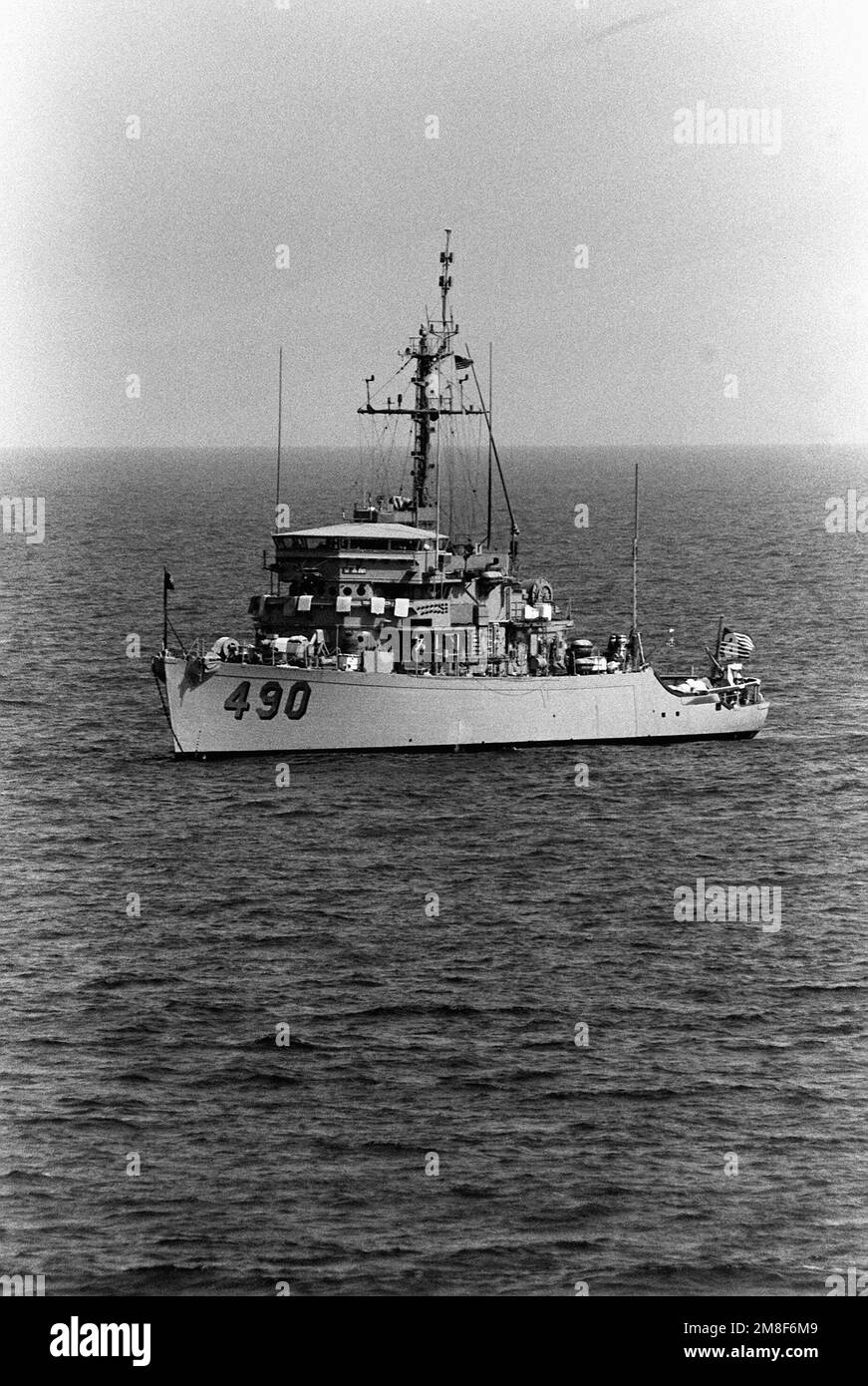A port bow view of the ocean minesweeper USS LEADER (MSO-490) underway ...
