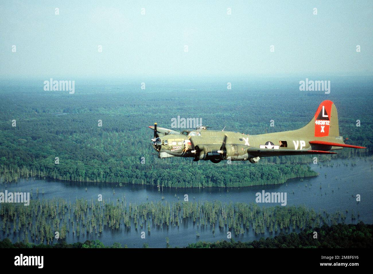 An air-to-air left side view of the restored World War II B-17G Flying ...