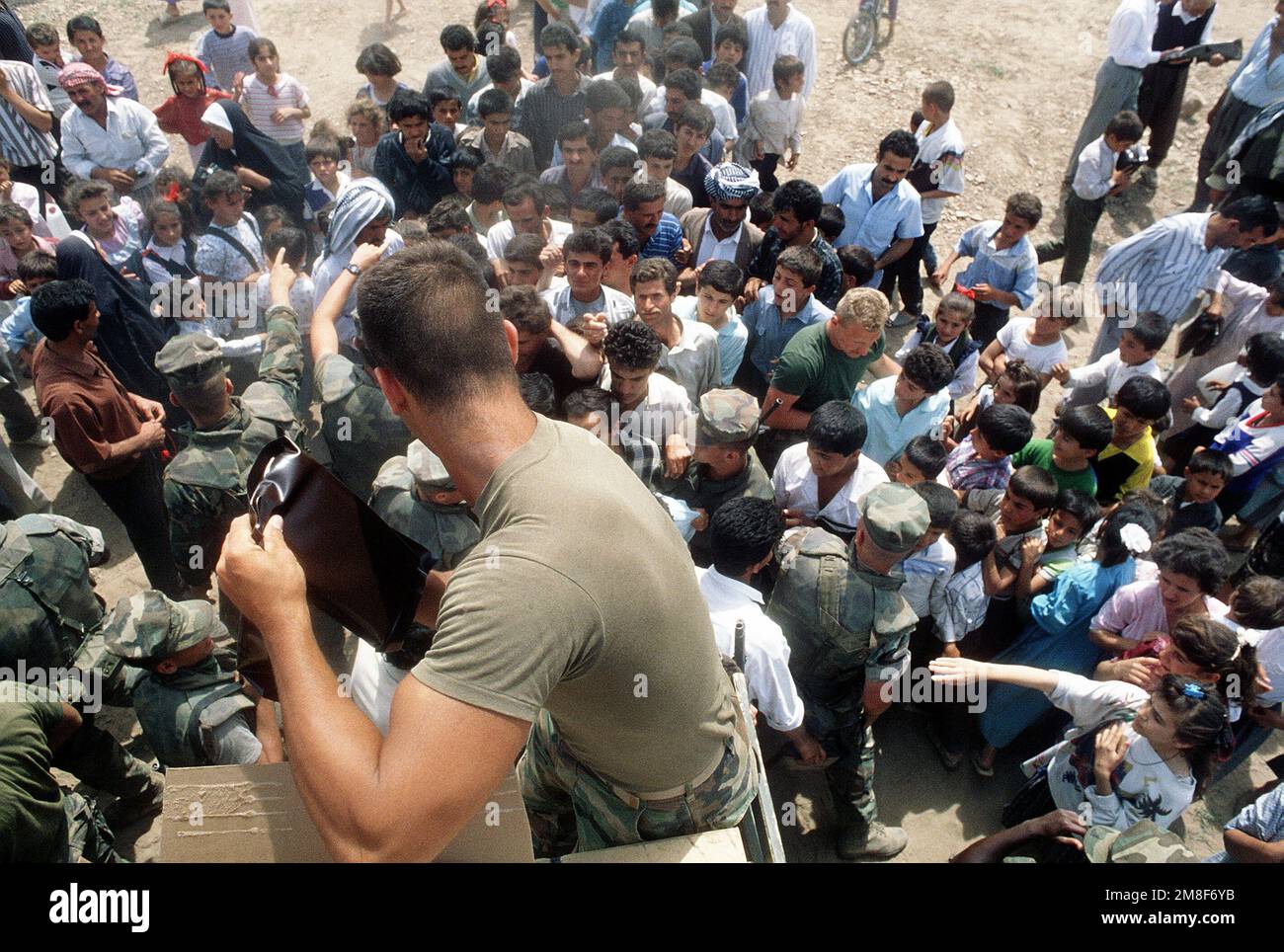 Marines on the ground try to maintain order as meals, ready to eat ...