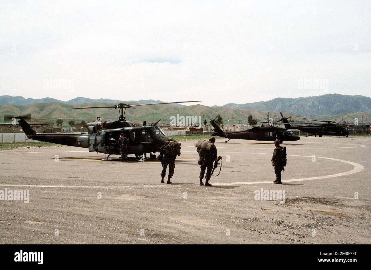 A UH-1N Iroquois, UH-60 Black Hawk and CH-53E Super Stallion helicopter ...