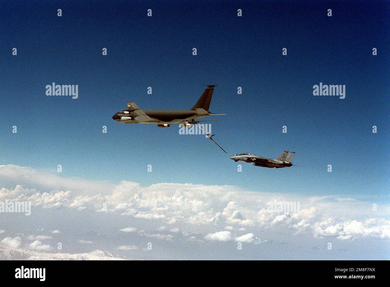 A Fighter Squadron 84 (VF-84) F-14A Tomcat aircraft conducts an aerial ...