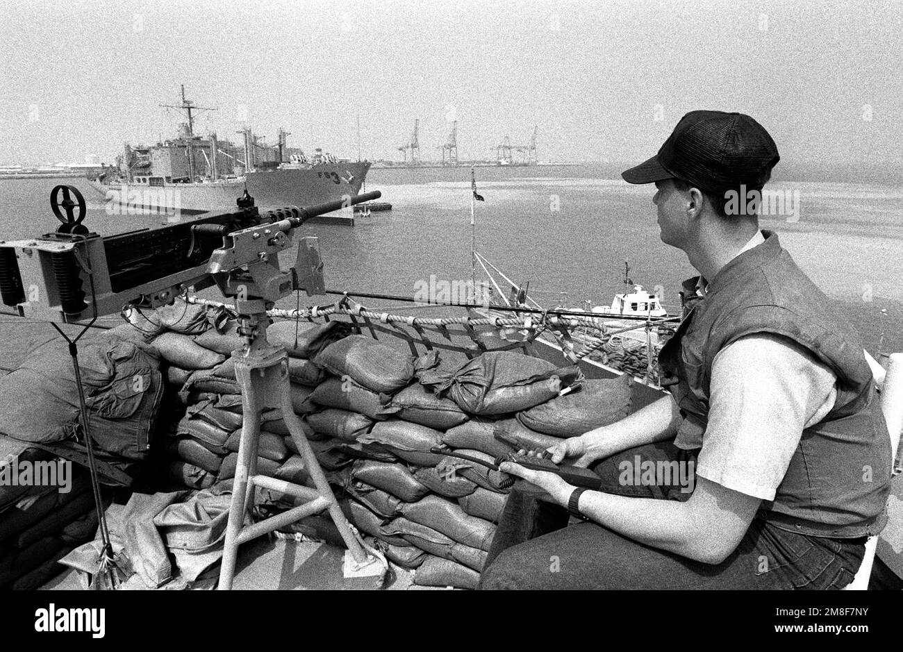 A crew member aboard the amphibious command ship USS BLUE RIDGE (LCC-19 ...
