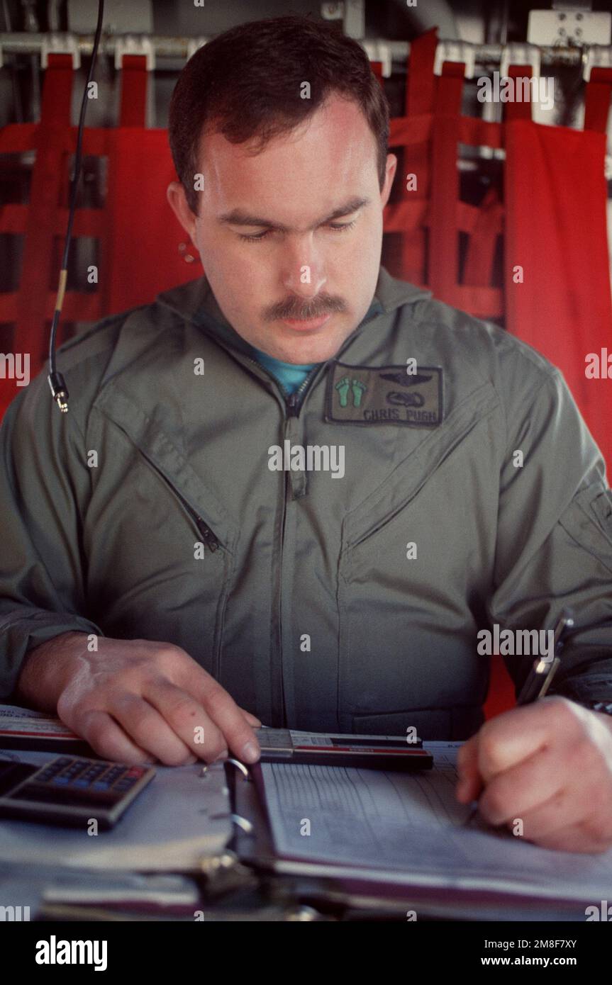SSGT Chris Pugh, 71st Air Rescue Squadron (71st ARS), calculates fuel ...