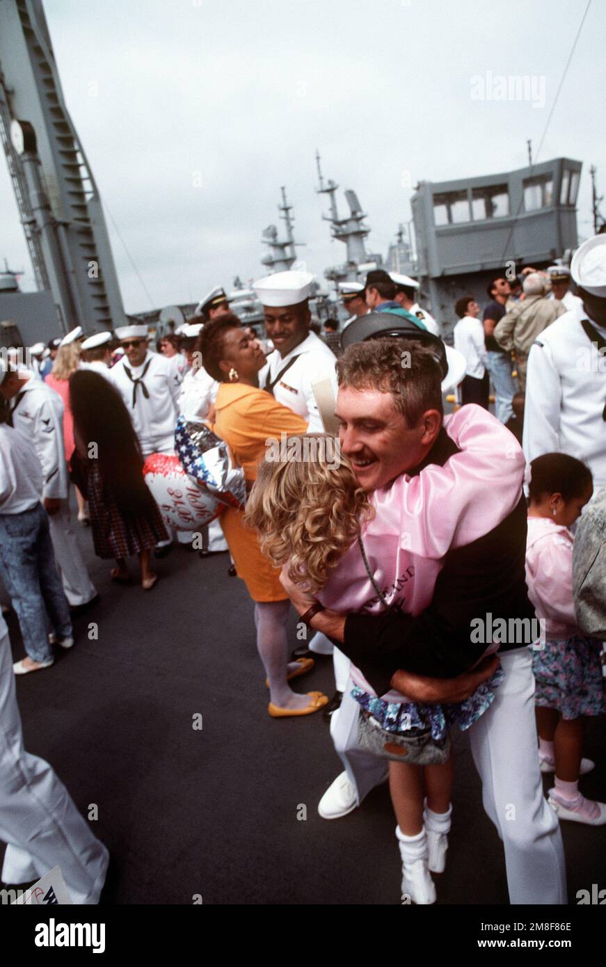 A crew member from the replenishment oiler USS KALAMAZOO (AOR-6) is ...